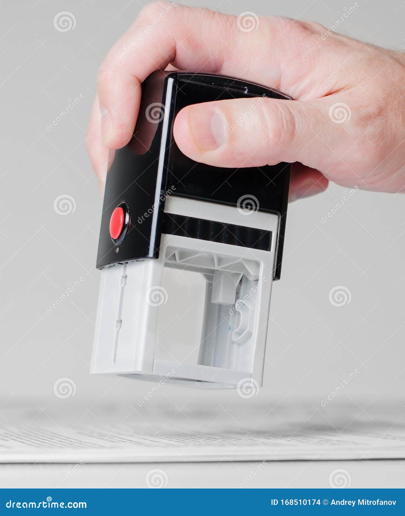 A Lawyer or Notary Puts a Seal on the Document. a Stamp in a Man`s Hand ... A Lawyer or Notary Puts a Seal on the Document. a Stamp in a Man`s Hand ...