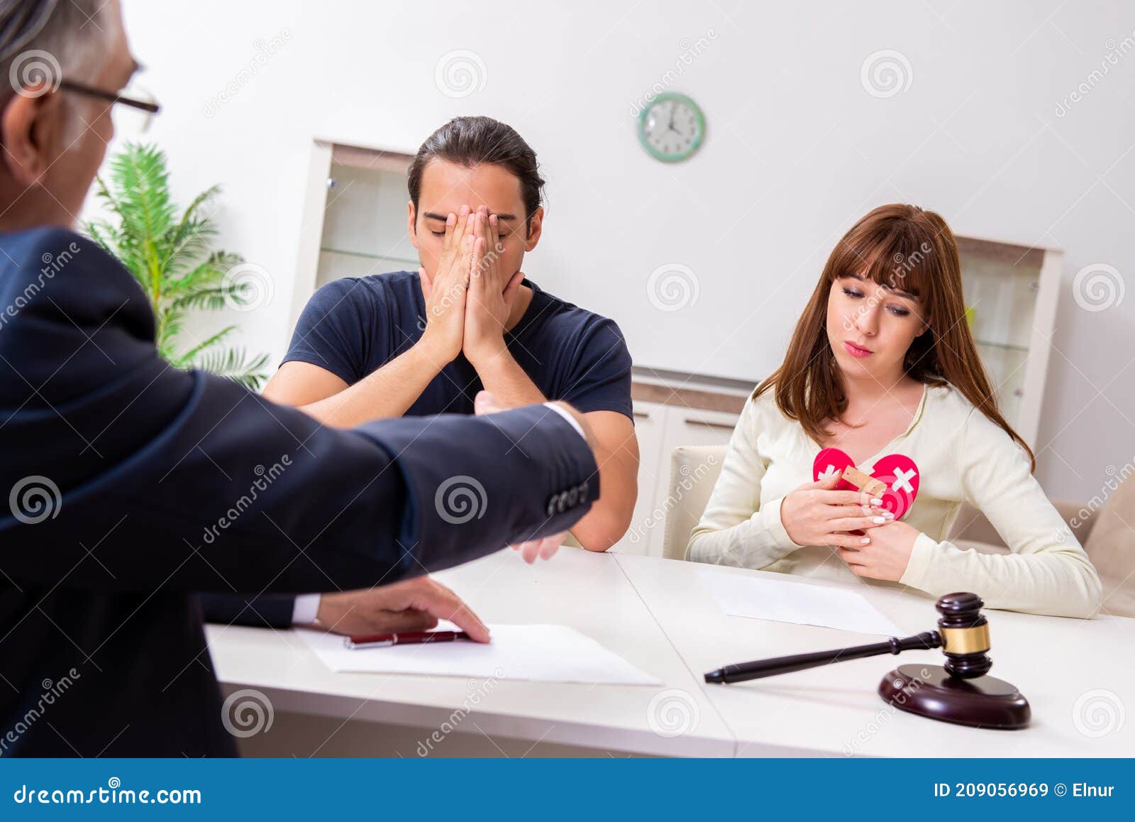 Lawyer Talking To Divorcing Couple at Home Stock Image - Image of model ...