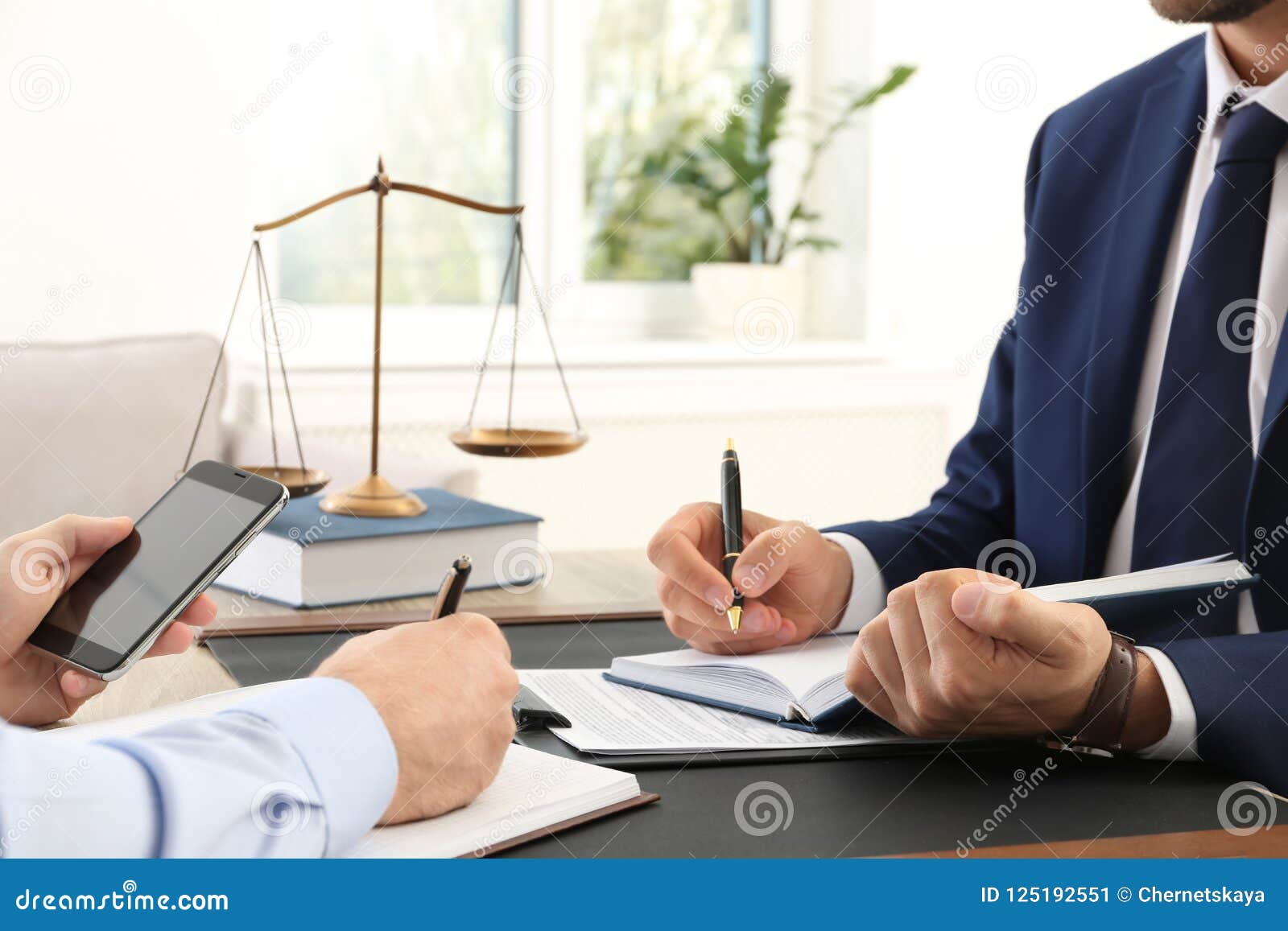 Lawyer Working with Client at Table in Offic Stock Image - Image of ...