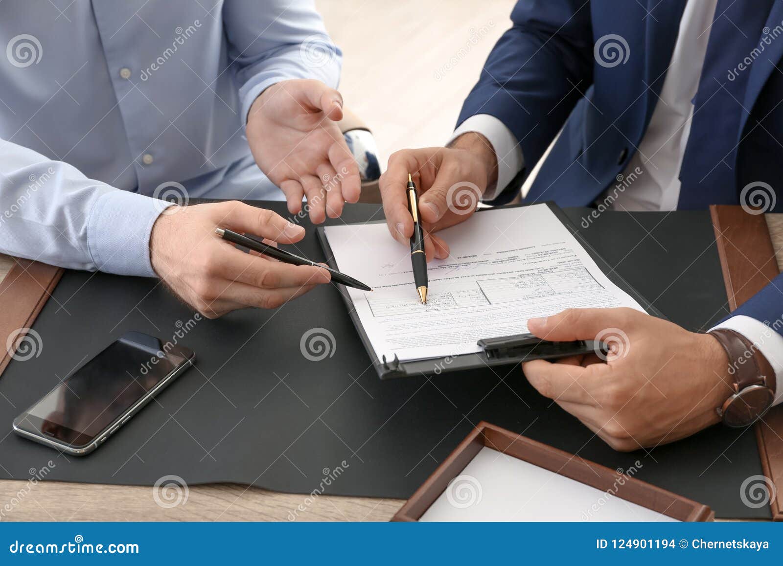 Lawyer Working with Client at Table in Office Stock Photo - Image of ...