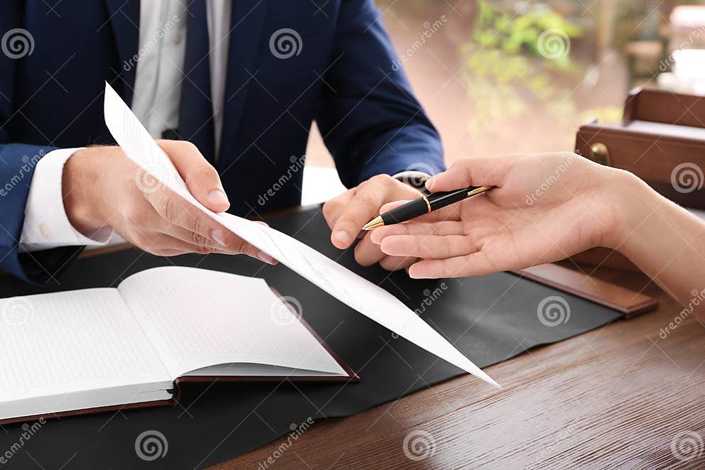 Lawyer Working with Client at Table in Office Stock Image - Image of ...