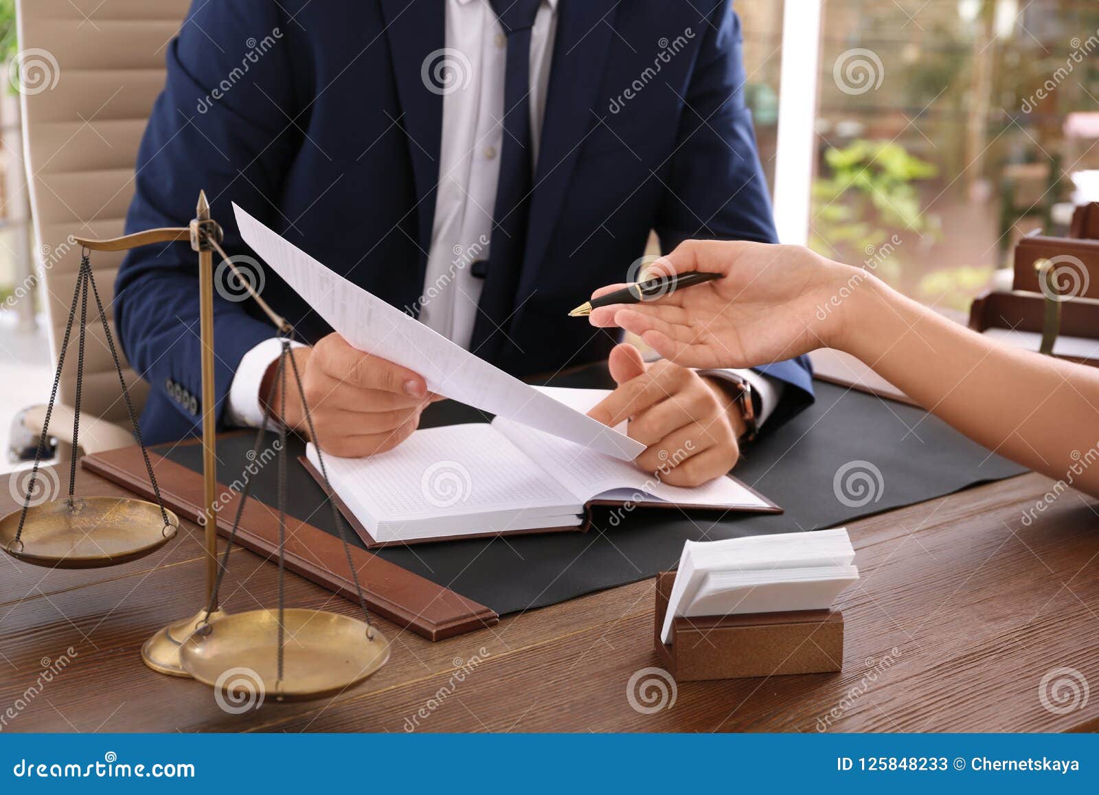 Lawyer Working with Client at Table in Office Stock Image - Image of ...
