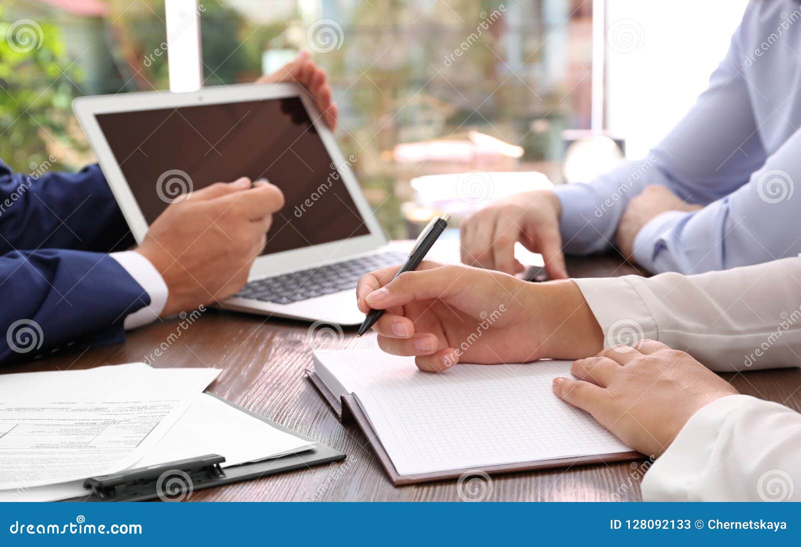 Lawyer Working with Clients at Table in Office Stock Image - Image of ...