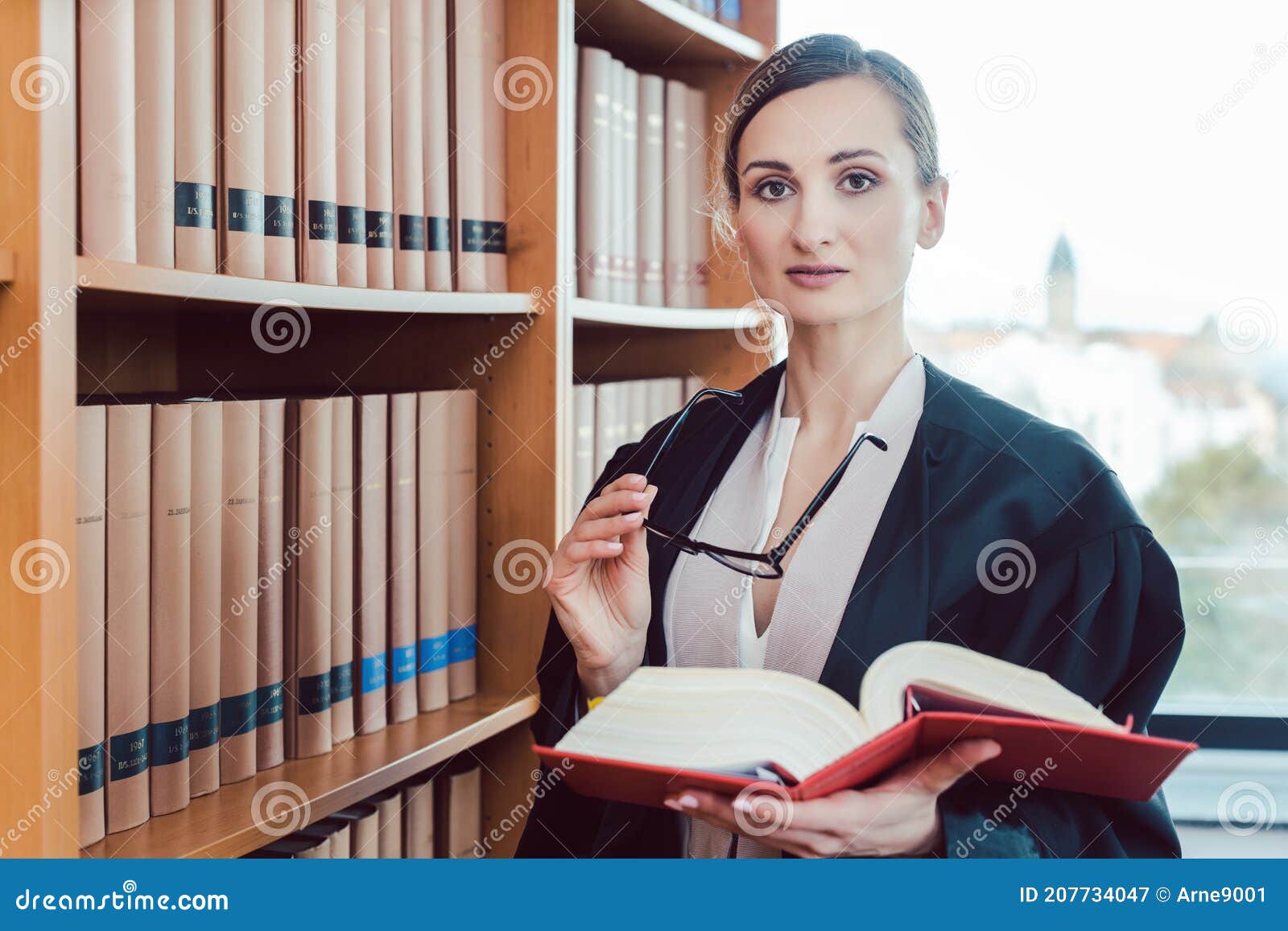 Lawyer Working on a Difficult Case Reading in the Library Stock Image ...