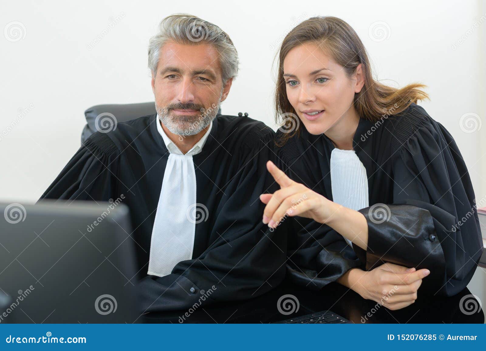 Lawyers Looking at Computer in Court Gowns Stock Image - Image of ...