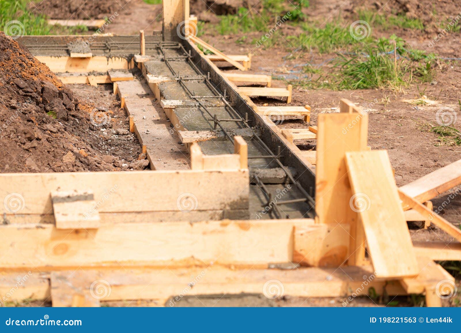 Lay of the Cement or Concrete into the Foundation Formwork with ...