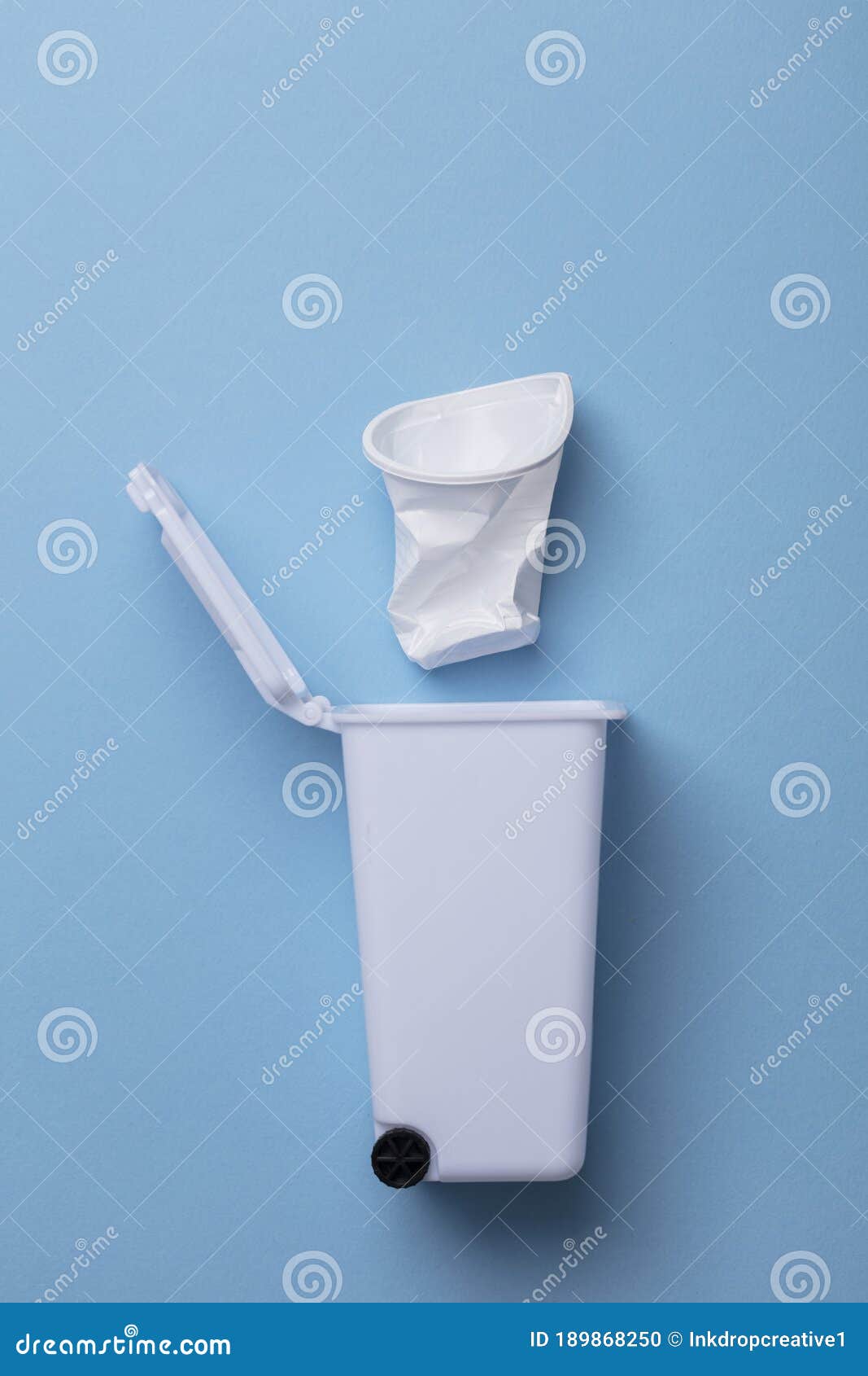 Lay Flat of Trash Bin with a Plastic Cup. Recycling Concept Stock Photo ...