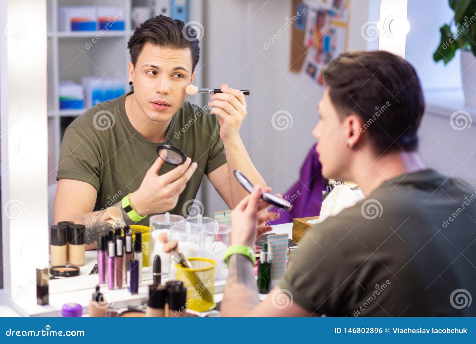 Accurate Extraordinary Guy Covering Face with Powder Makeup Stock Photo ...