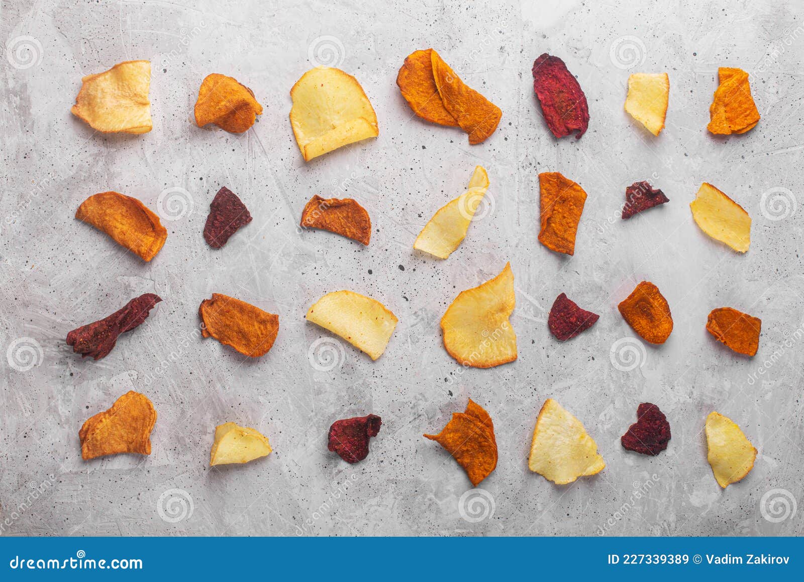 Layered Rows of Vegetable Chips on a Concrete Background Stock Image ...