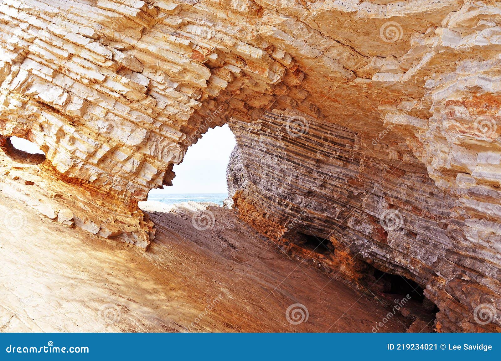 Layered Sandstone Rock Cave with View of Ocean Stock Image - Image of ...