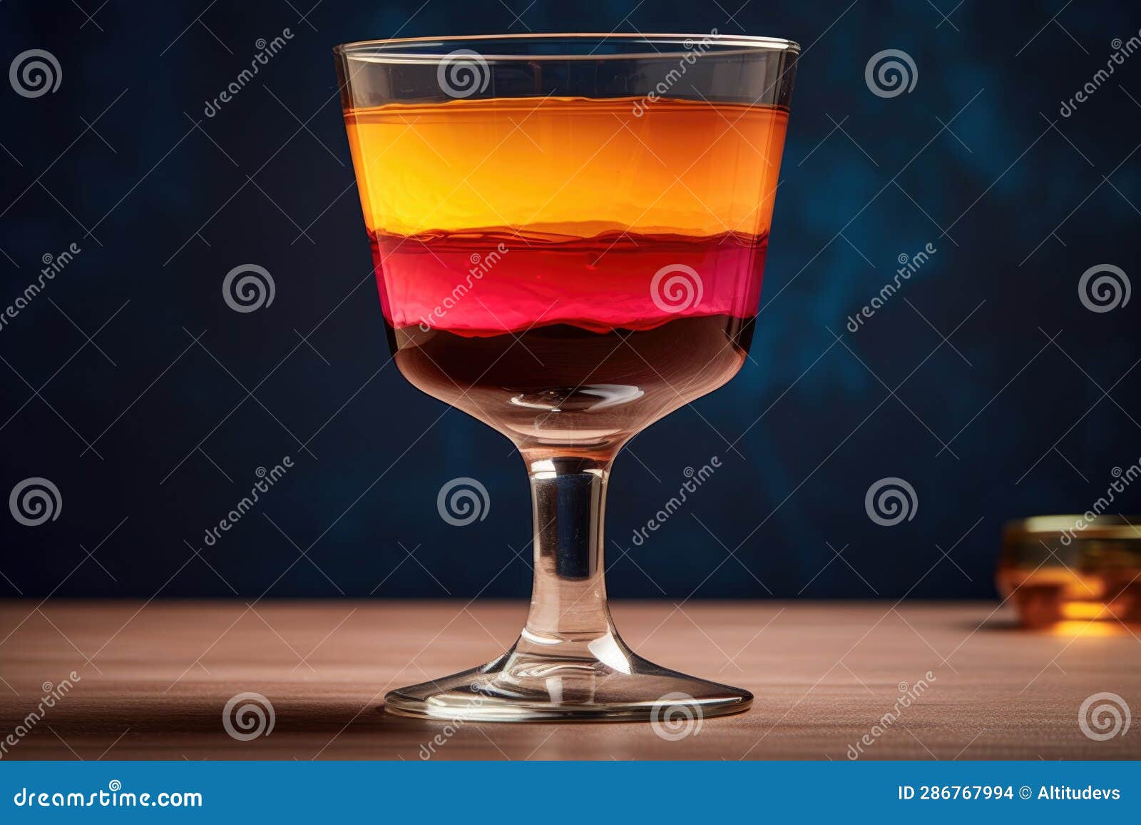 Layering Different Colored Liquids in a Cocktail Glass Stock Photo ...