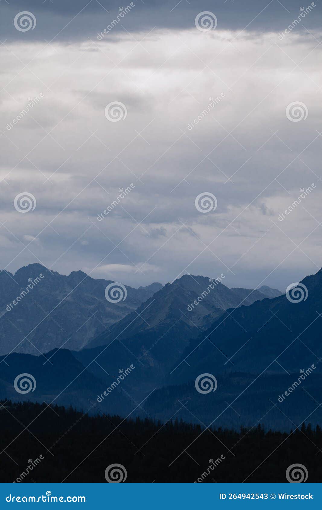 Layers of Mountain Range in Shades of Blue, Vertical Stock Image ...
