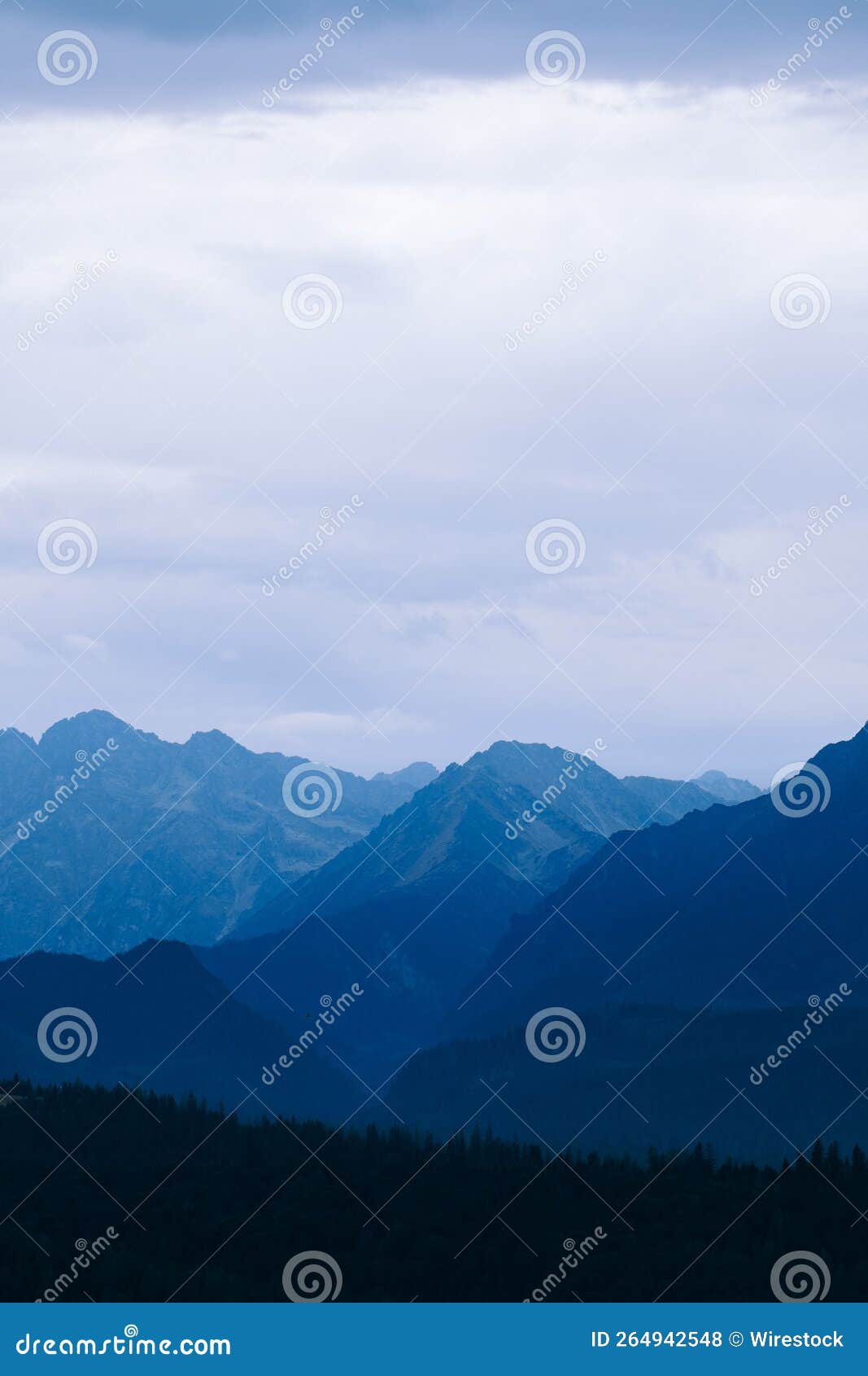 Layers of a Mountain Range in Shades of Blue, Vertical Stock Photo ...