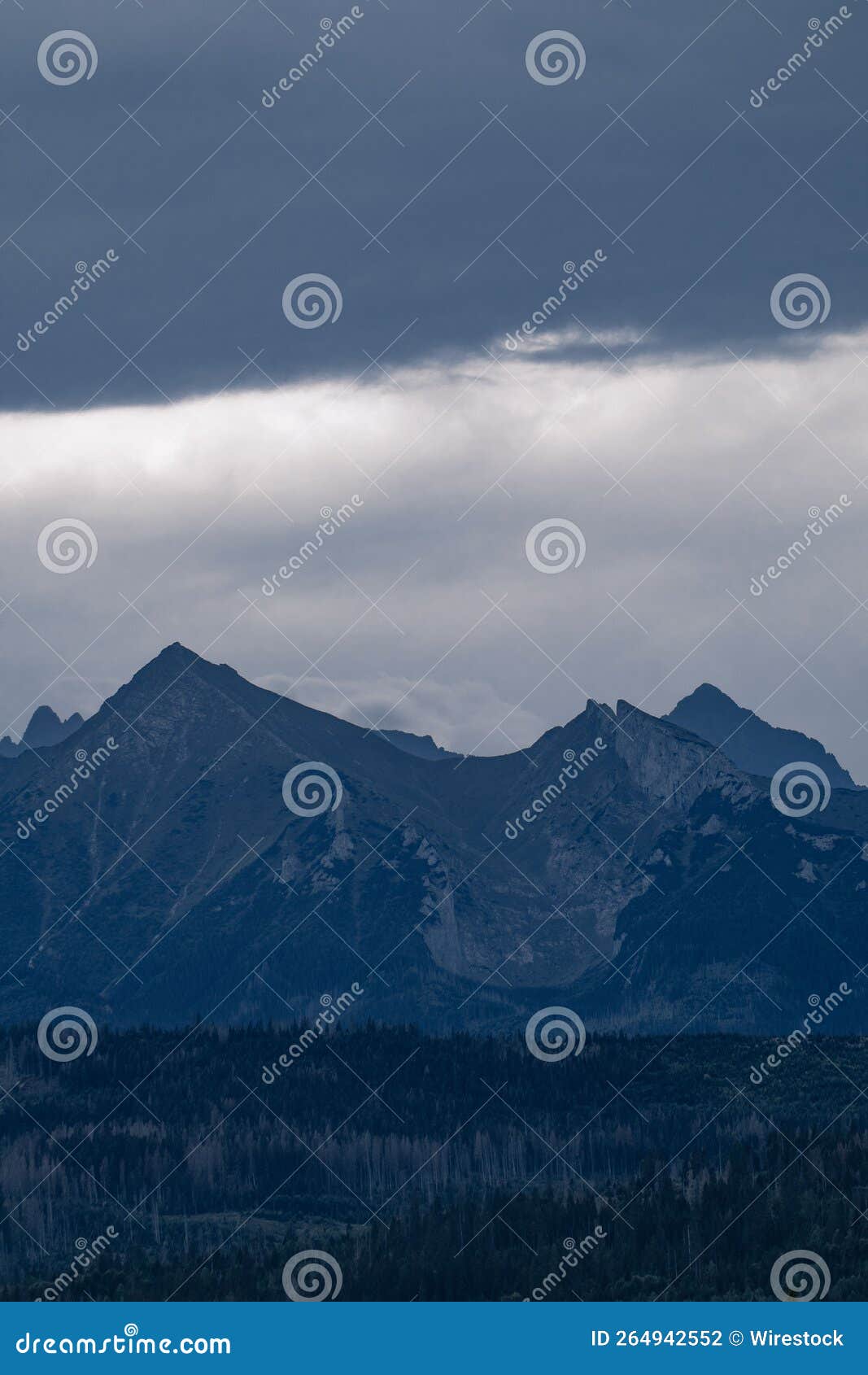 Layers of Mountain Range in Shades of Blue, Vertical Stock Photo ...