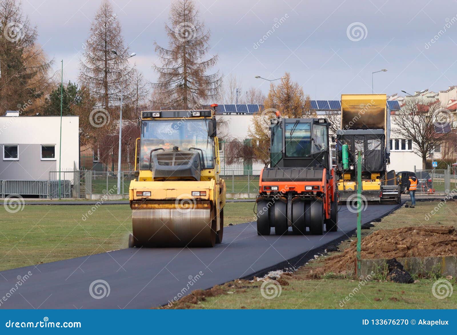 Laying Asphalt with the Help of Heavy Special Equipment. the ...