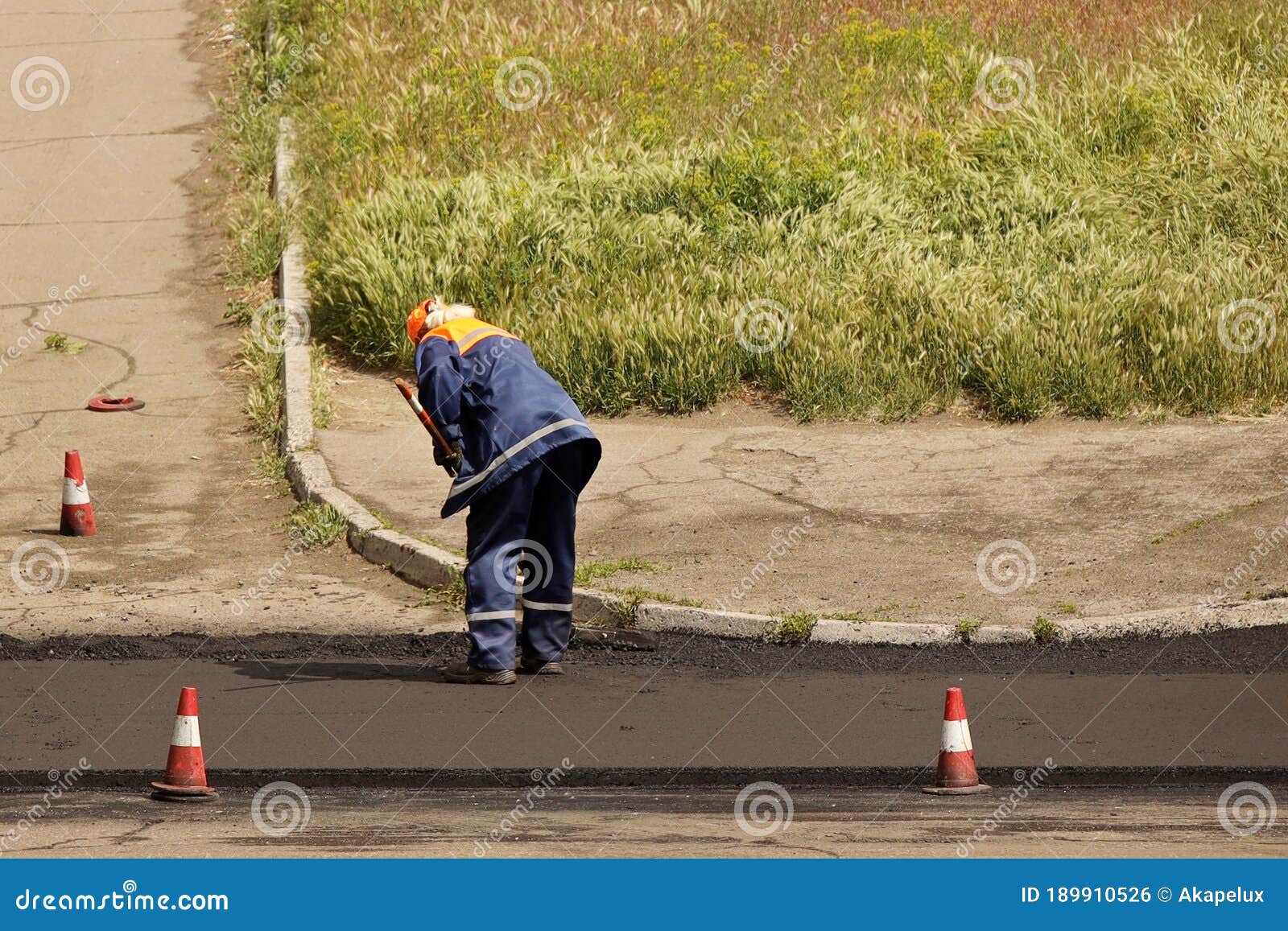 Laying Asphalt By Workers. Road Construction. Modern Technology Of ...