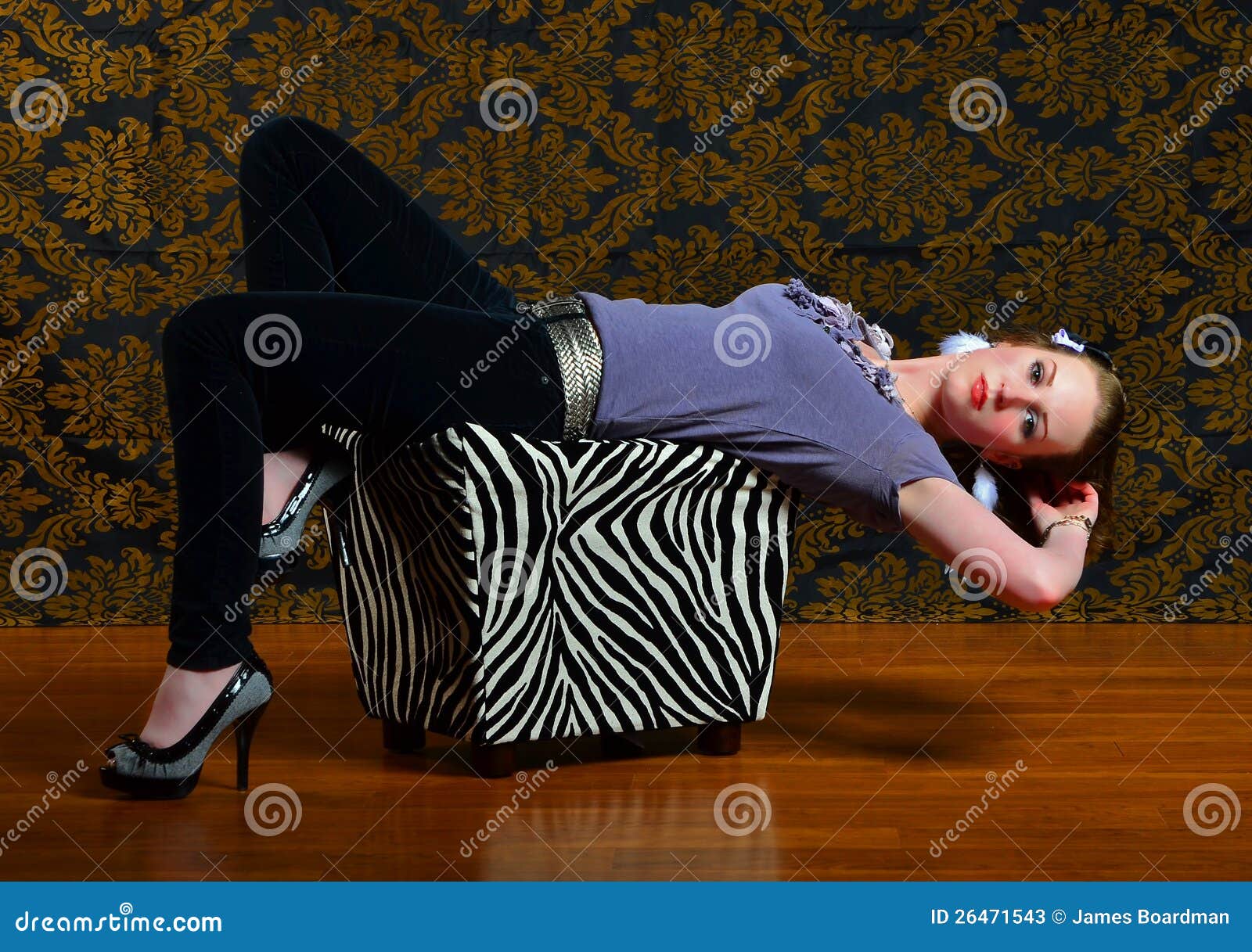 Laying back on a footstool stock image. Image of woman - 26471543