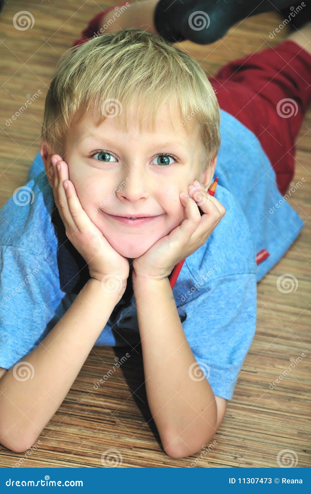 Laying boy stock image. Image of student, funny, smile - 11307473