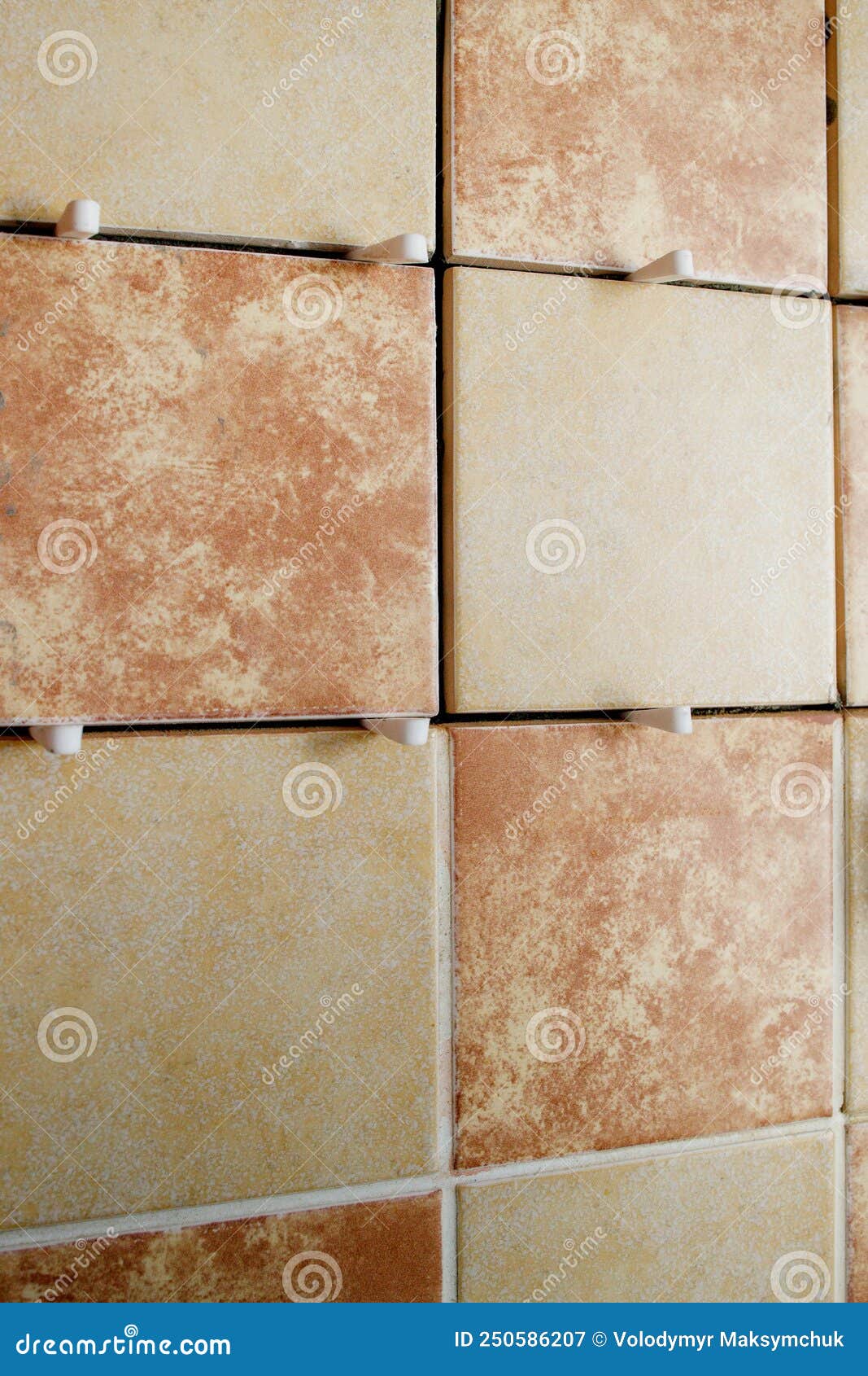 Laying Ceramic Tiles with the Help of Crosses for a Tile by during Wall ...