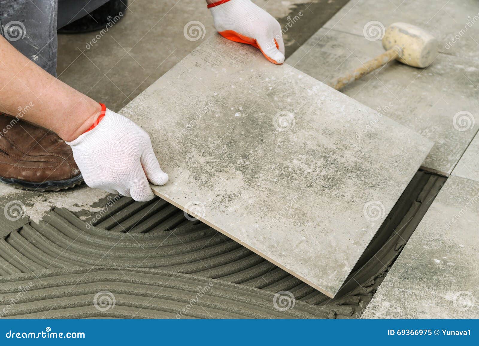 Laying Ceramic Tiles. stock image. Image of cement, repairing - 69366975
