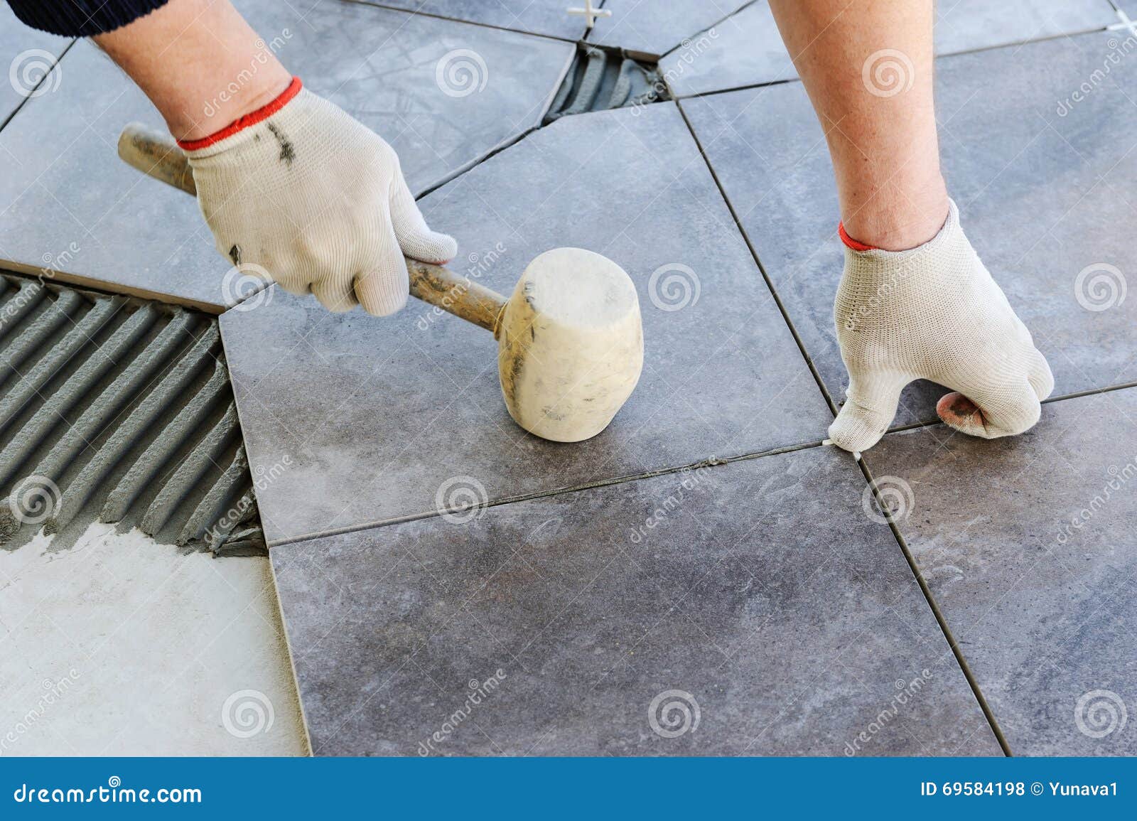 Laying Ceramic Tiles. stock photo. Image of closeup, home - 69584198