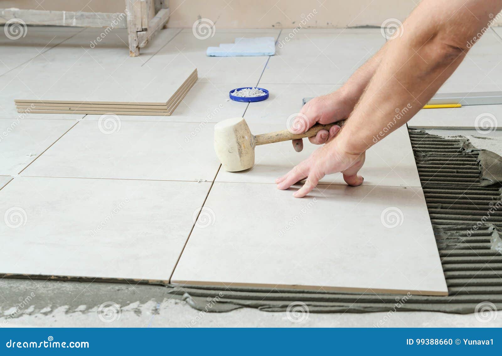 Laying Ceramic Tiles. stock photo. Image of wall, flat - 99388660