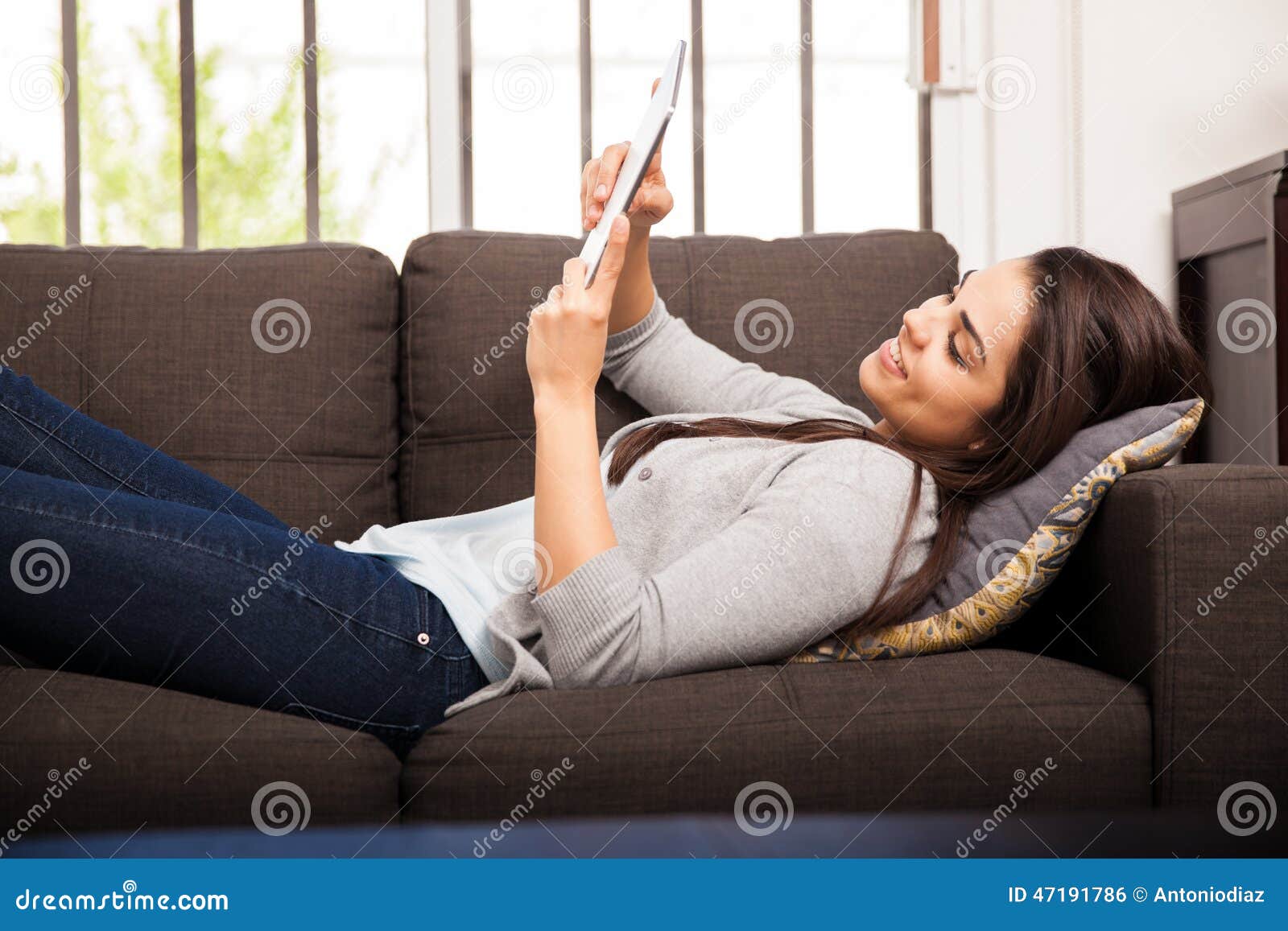 Laying on a Couch and Reading Stock Photo - Image of novel, living ...