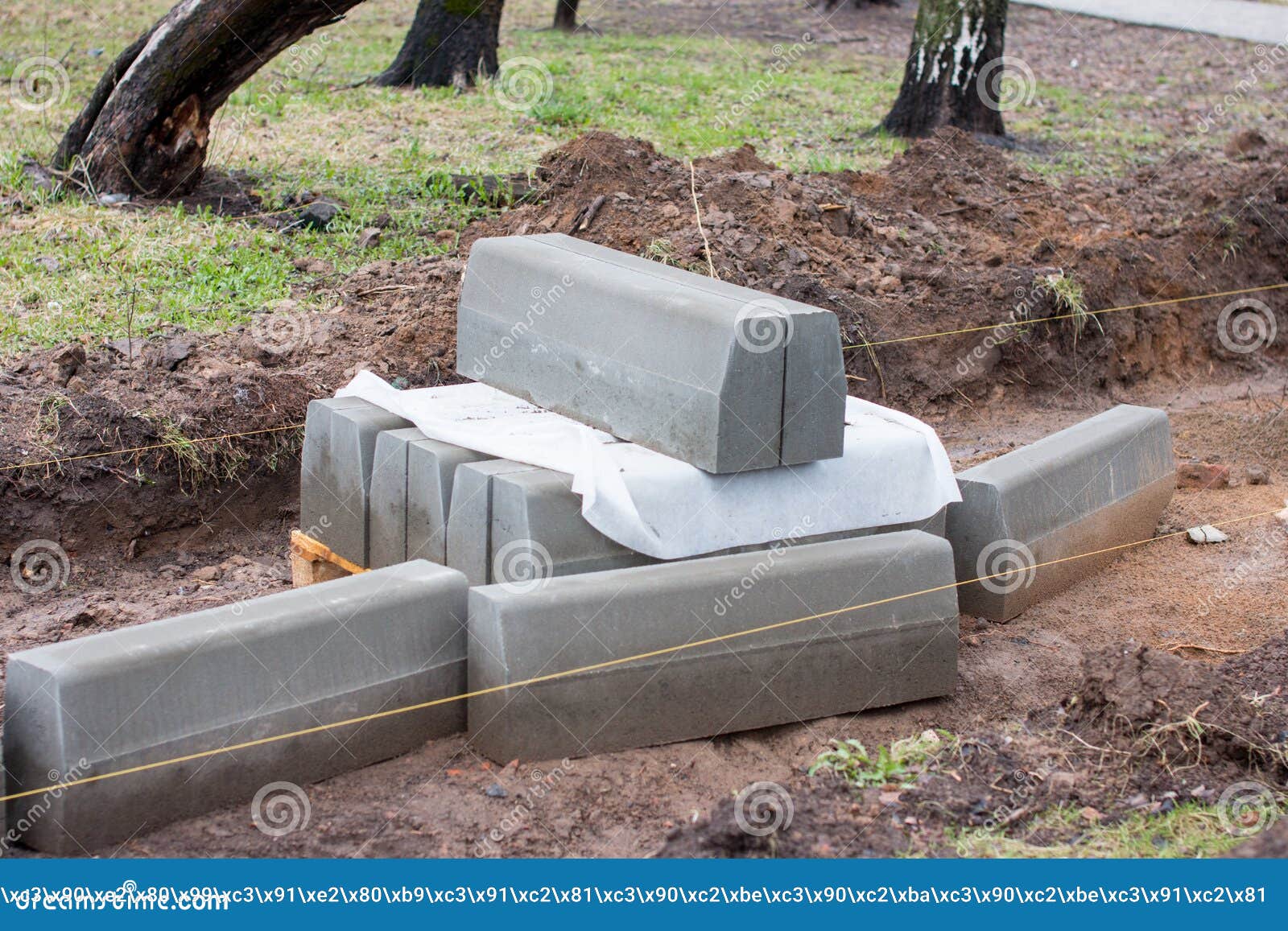 Laying of a curbstone. stock photo. Image of blocks - 217208664