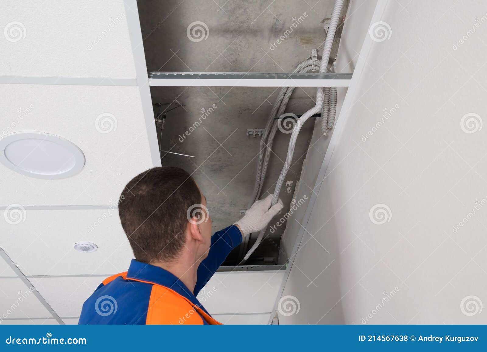 Laying of Electrical Cables and the Internet Above the False Ceiling ...