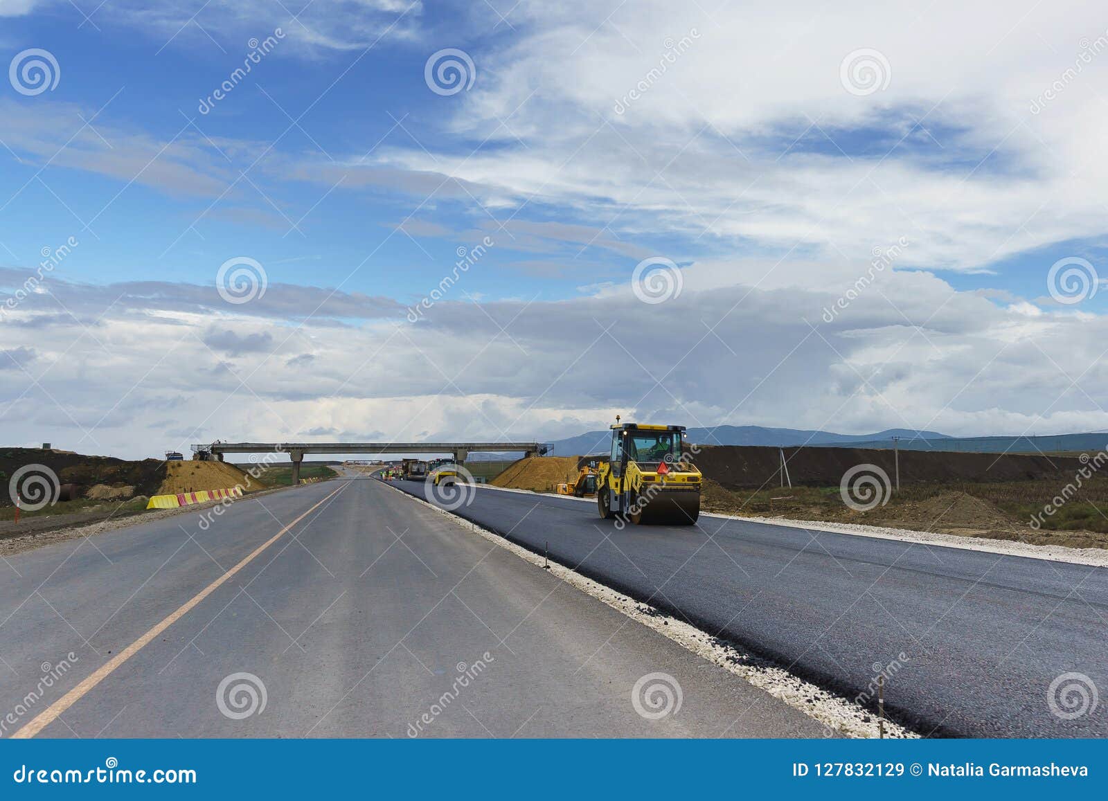 Laying the Final Layer of Asphalt in the Construction of a New Road in ...