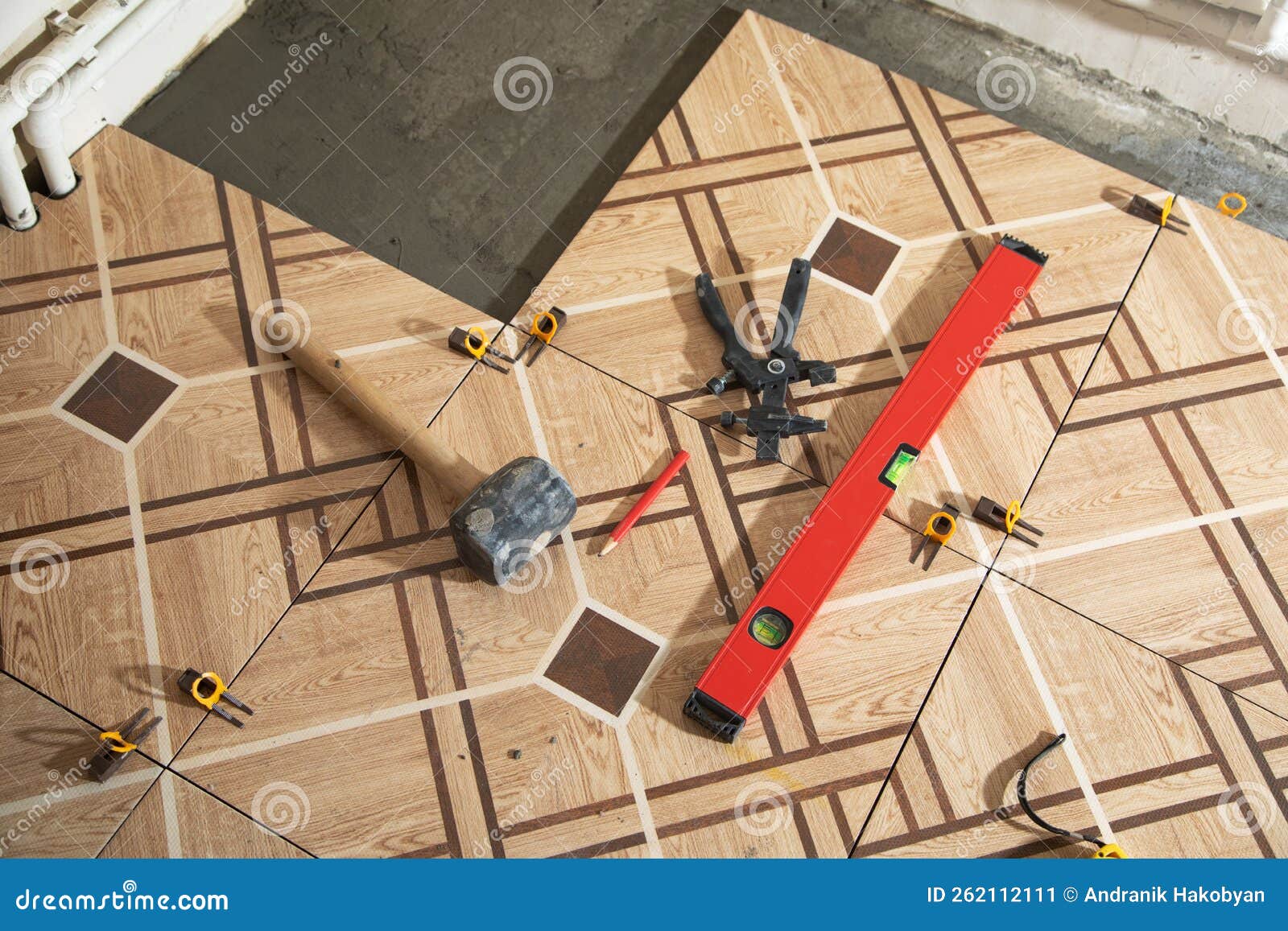 Laying Floor Ceramic Tile. Tools for Renovating Floor Stock Image ...