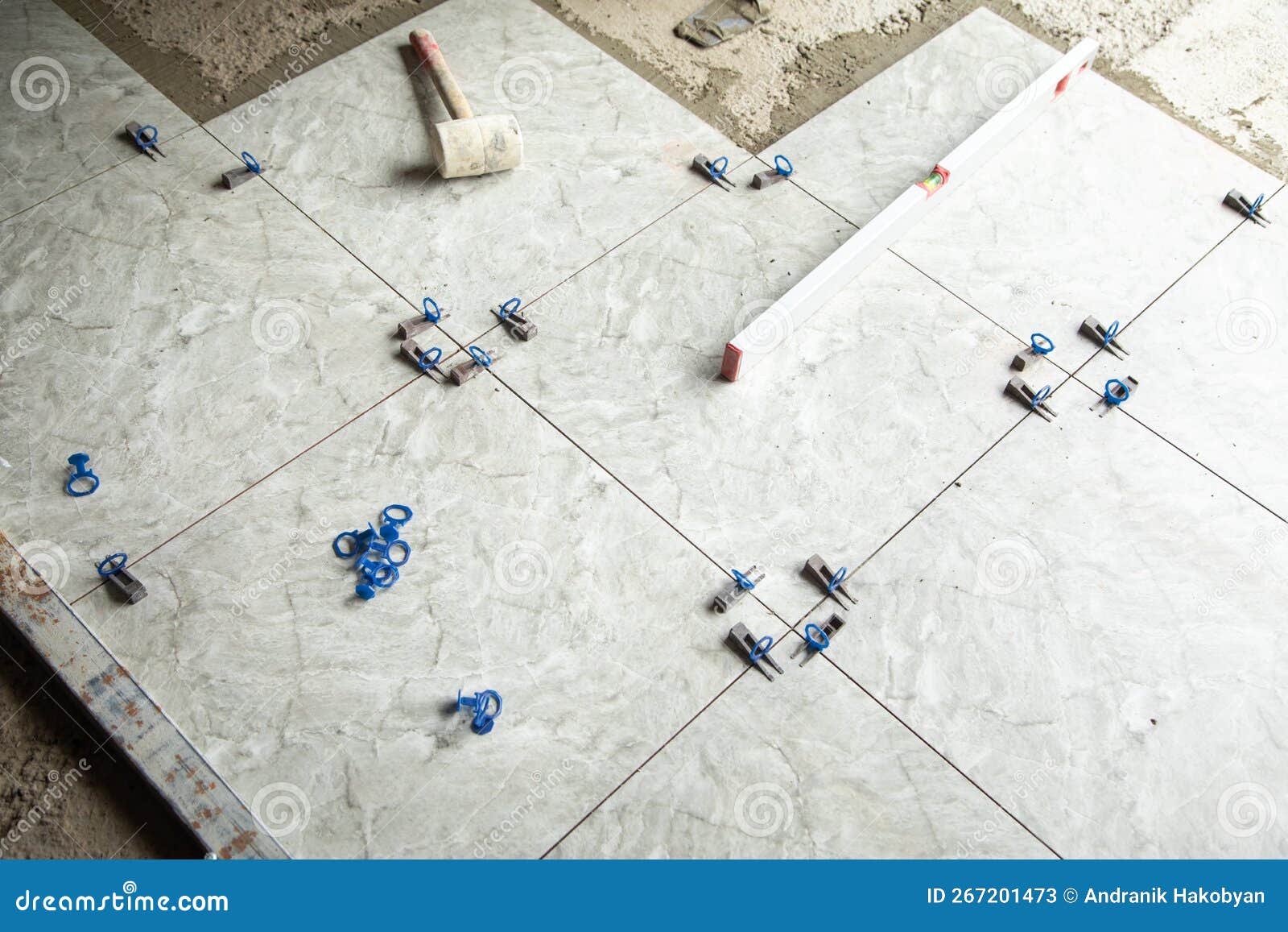 Laying Floor Ceramic Tile. Tools for Renovating Floor Stock Image ...