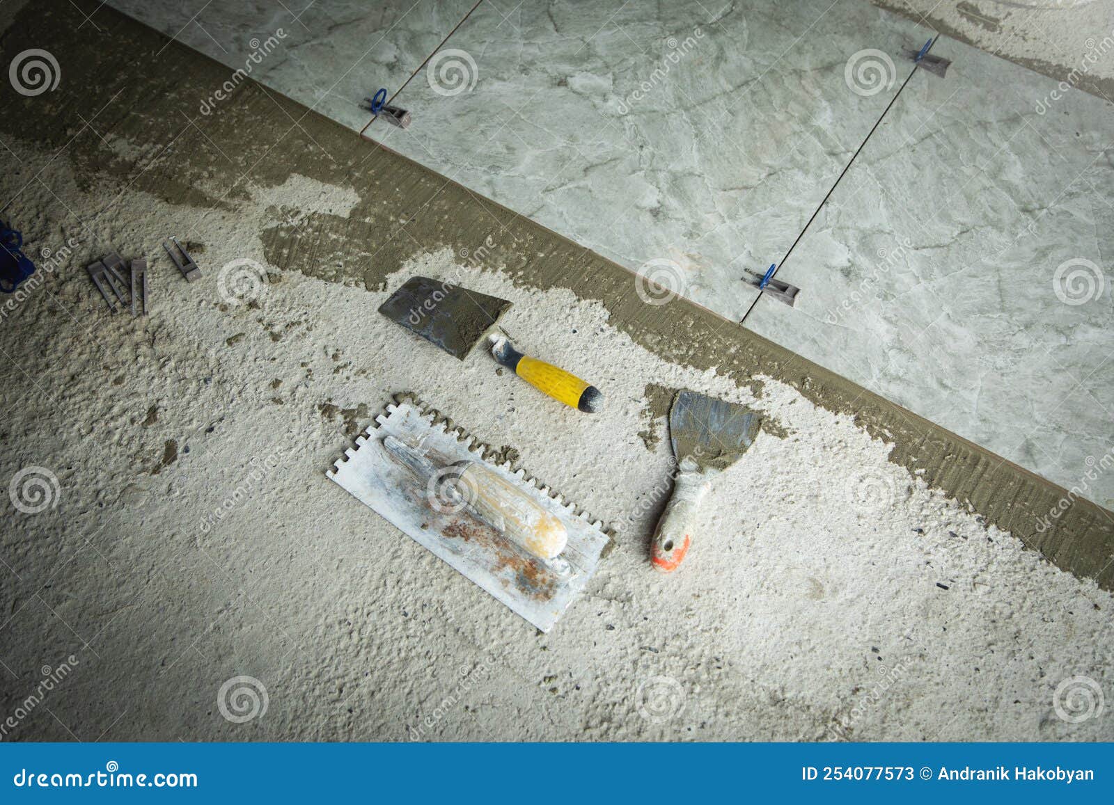 Laying Floor Ceramic Tile. Tools for Renovating Floor Stock Image ...