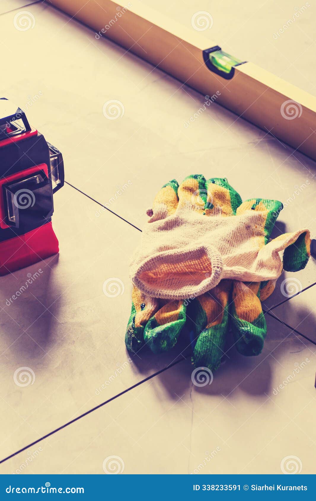 Laying Floor Tiles. Linear Level. Green Hand Gloves. Stock Image ...