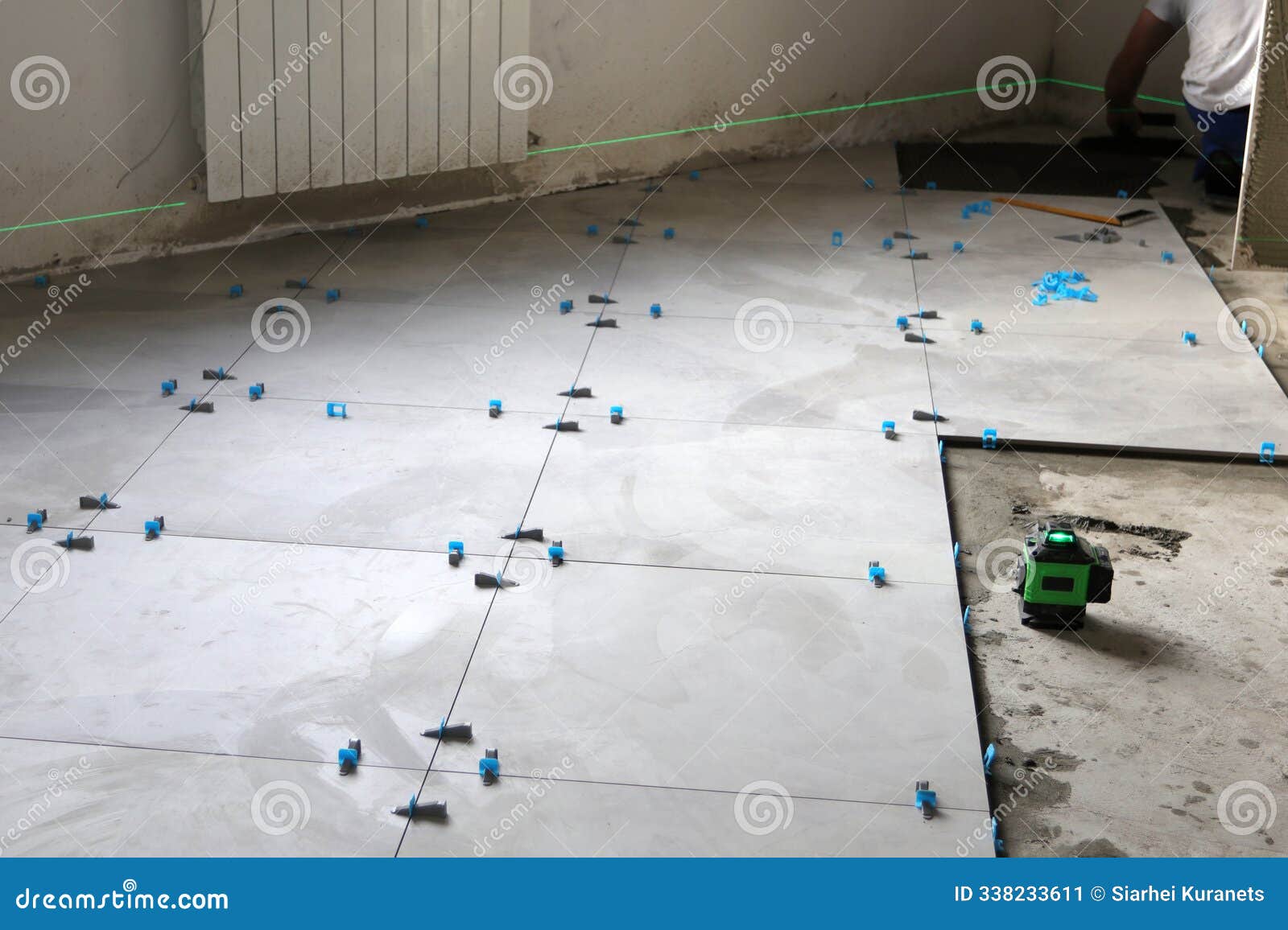 Laying Floor Tiles. Linear Level. Green Hand Gloves. Stock Image ...