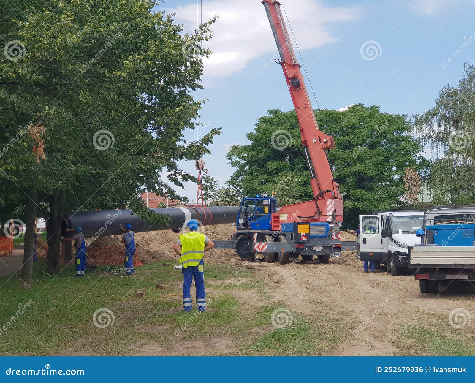 Laying Heating Pipes in a Trench at Construction Site Stock Photo ...