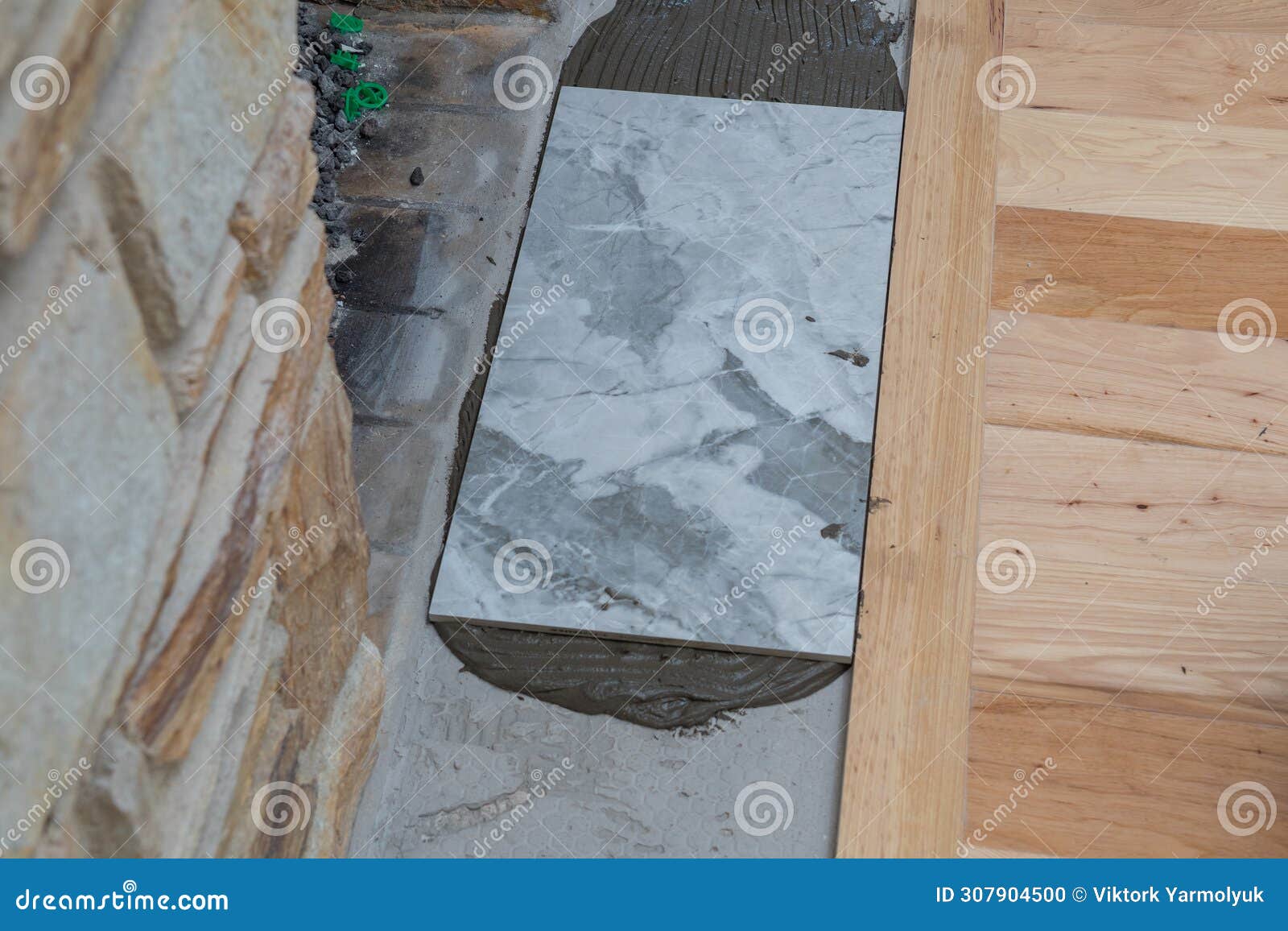 Laying marble tiles stock photo. Image of mortar, white - 307904500