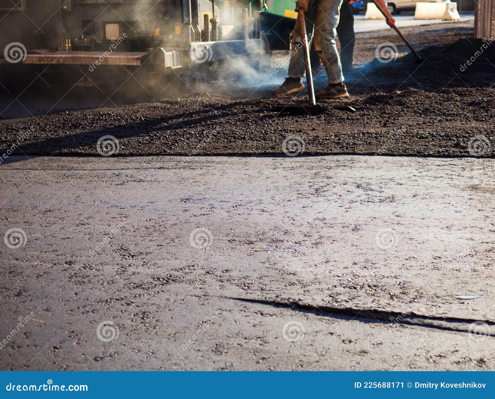 Laying New Asphalt. the Process of Leveling the Asphalt Manually Using ...