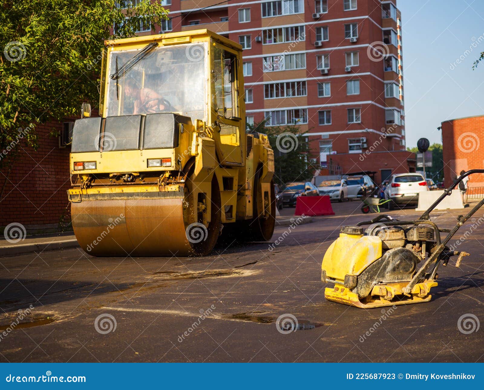 Laying New Asphalt. Single Direction Vibratory Plate in the Foreground ...