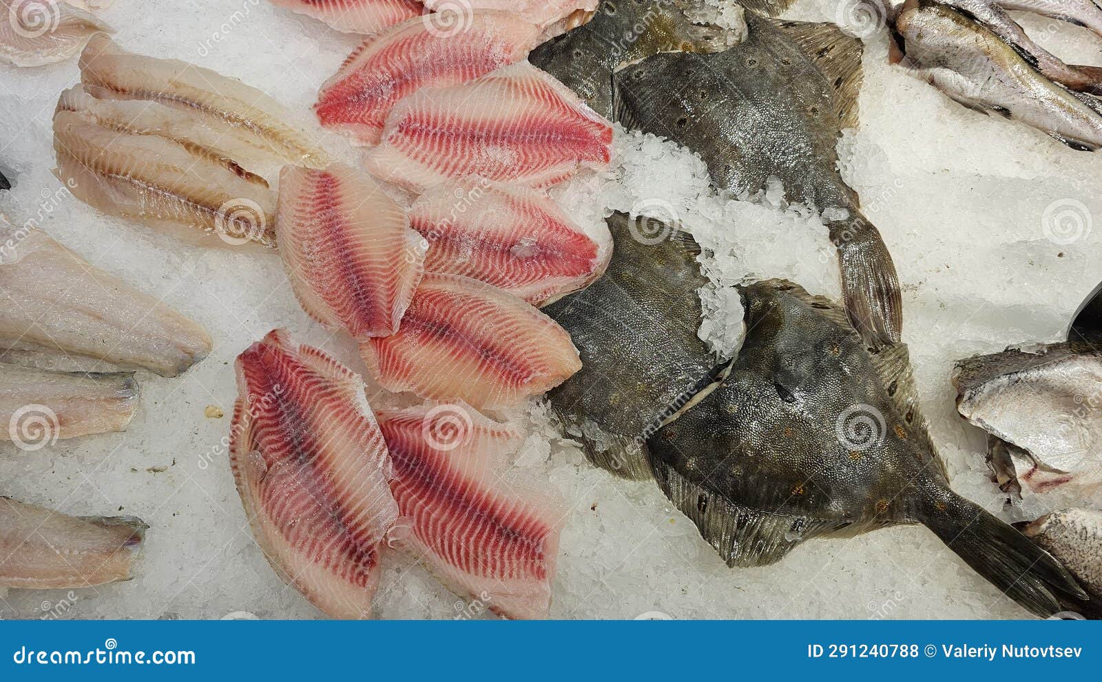 Laying Out Fresh Fish on Ice in a Grocery Store. Stock Photo - Image of ...