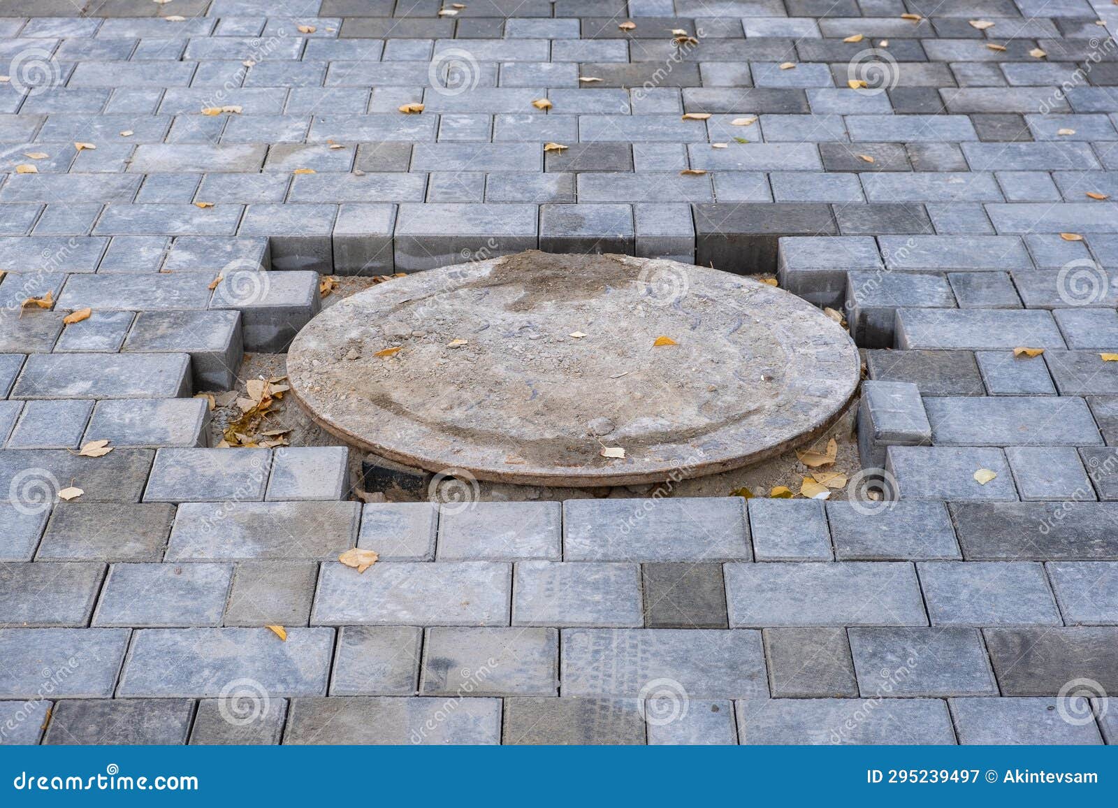 Laying Paving Slabs Around the Sewer Manhole Stock Image - Image of ...