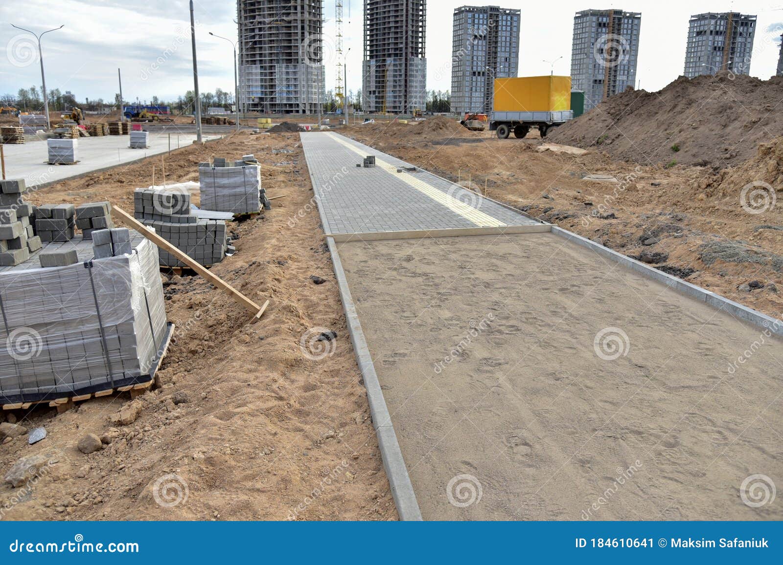 Laying Paving Slabs and Borders at Construction Site. Process of ...