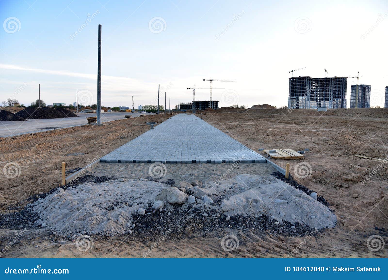 Laying Paving Slabs and Borders at Construction Site. Process of ...