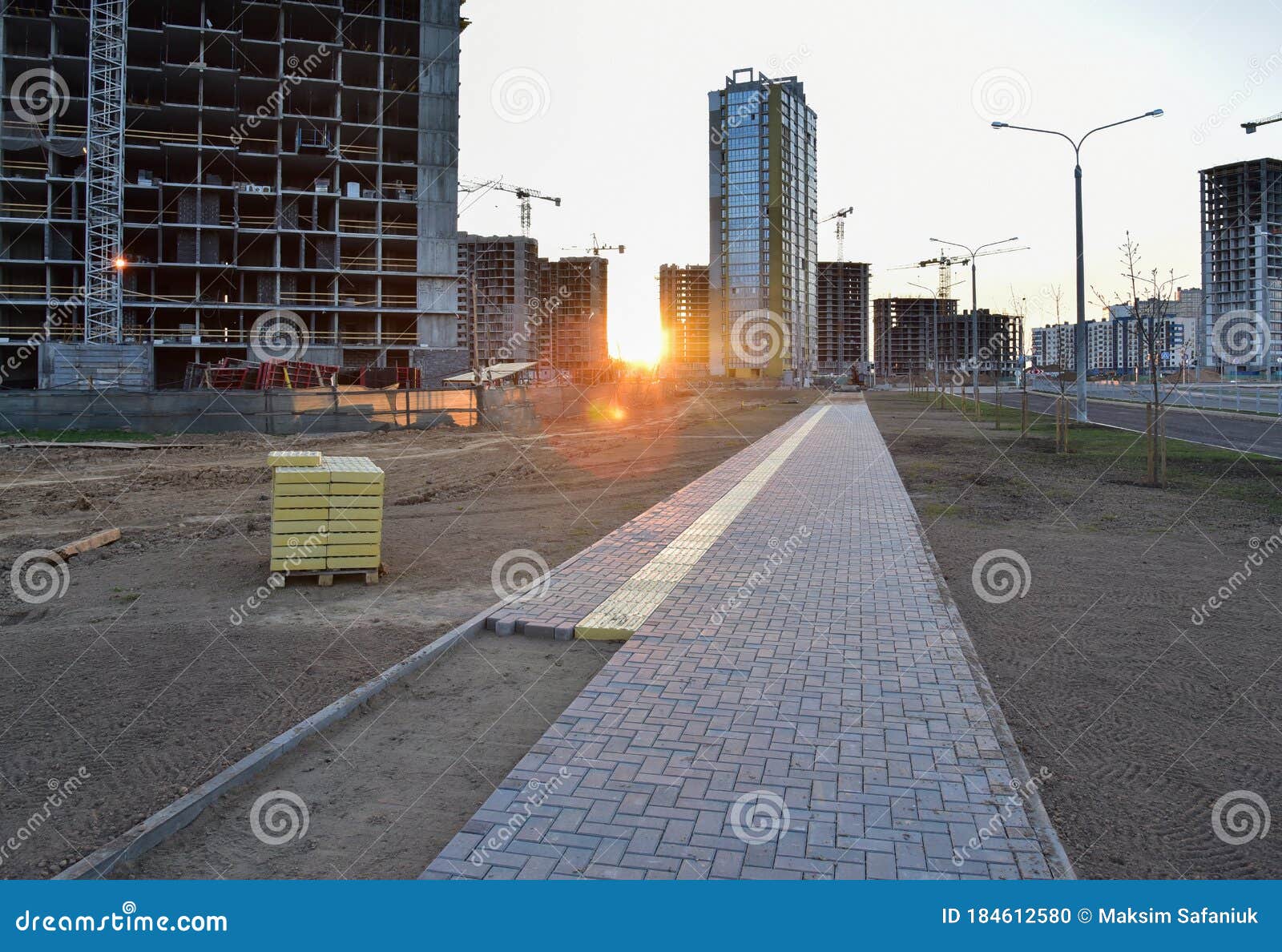 Laying Paving Slabs and Borders at Construction Site. Process of ...