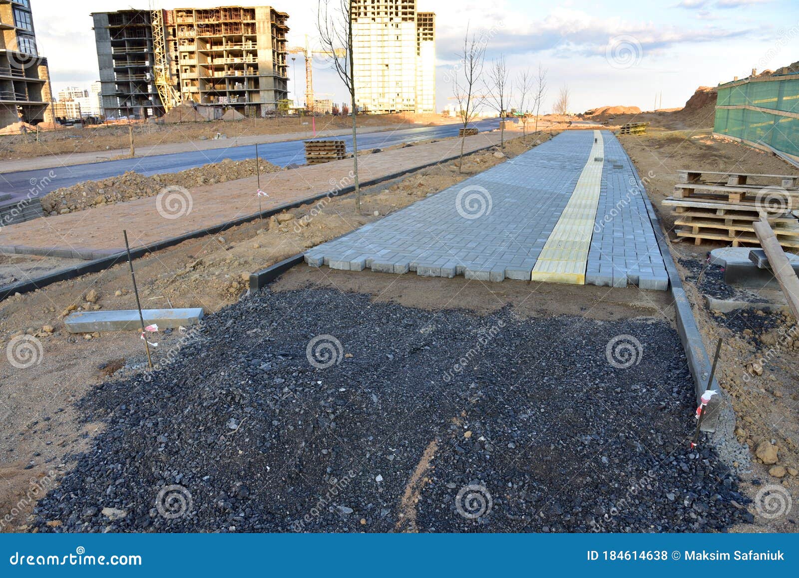 Laying Paving Slabs and Borders at Construction Site. Process of ...