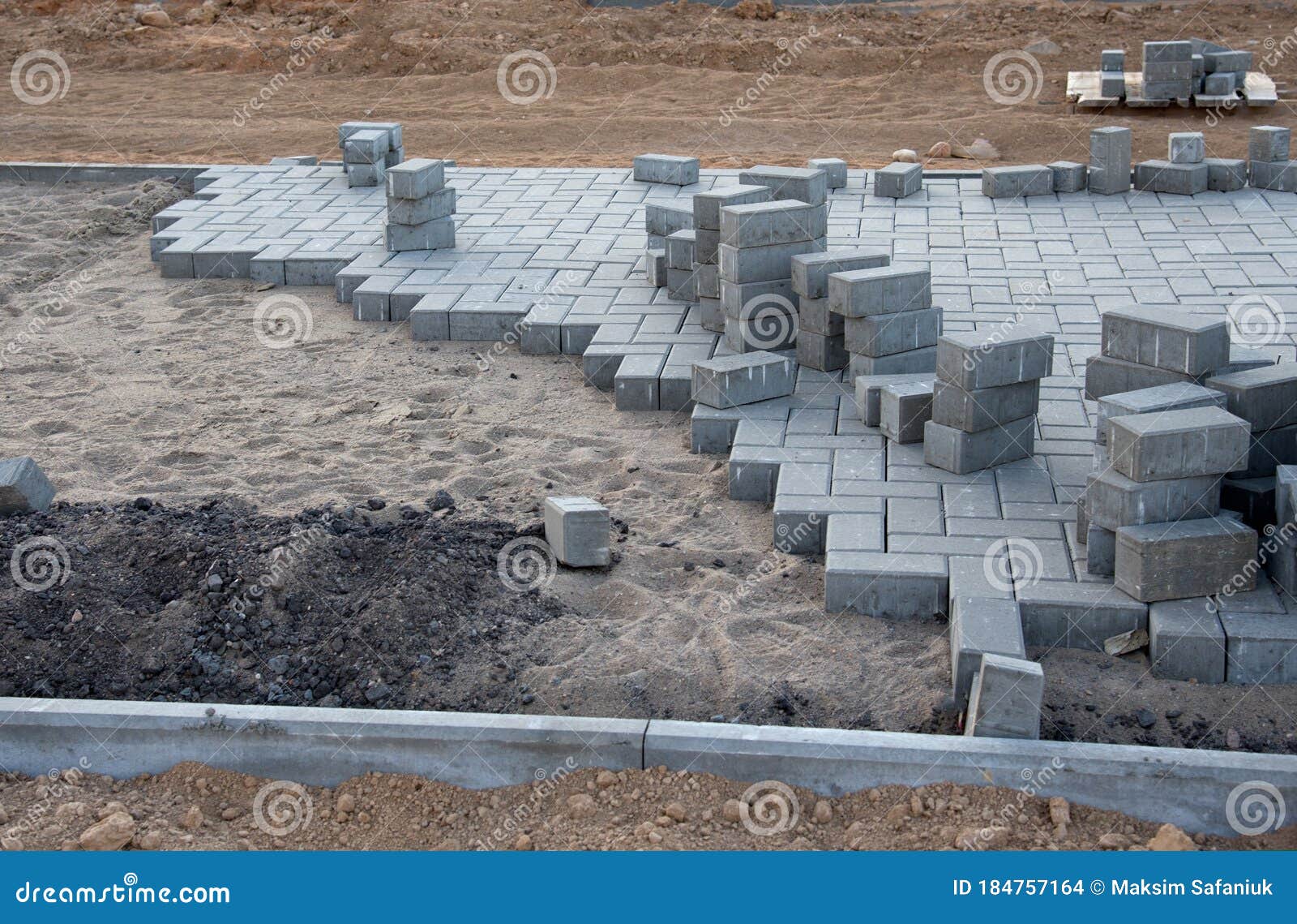 Laying Paving Slabs and Borders at Construction Site. Process of ...