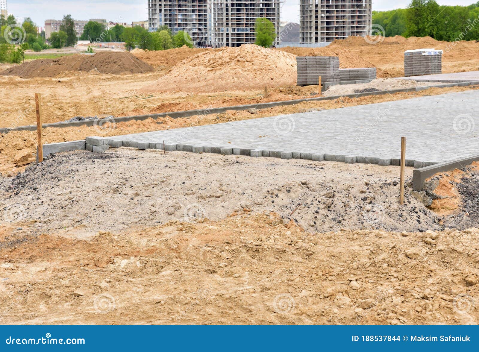Laying Paving Slabs and Borders at Construction Site. Process of ...