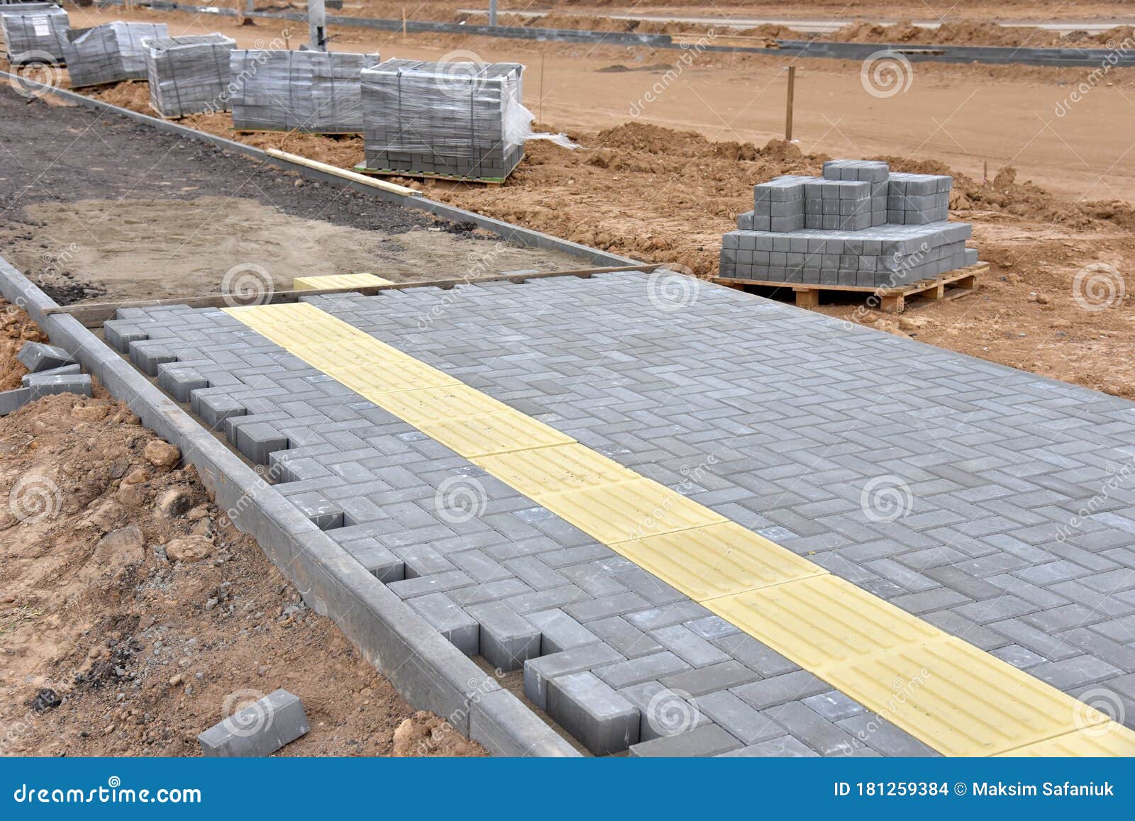 Laying Paving Slabs at Construction Site. Process of Installing Paving ...