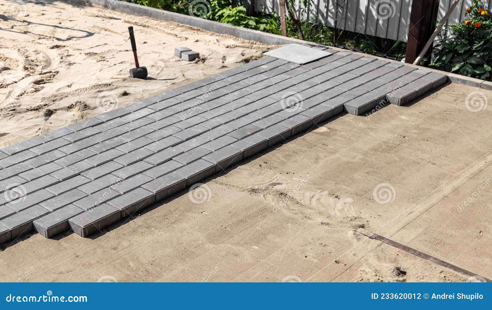 Laying Paving Slabs at a Construction Site. Stock Photo - Image of ...