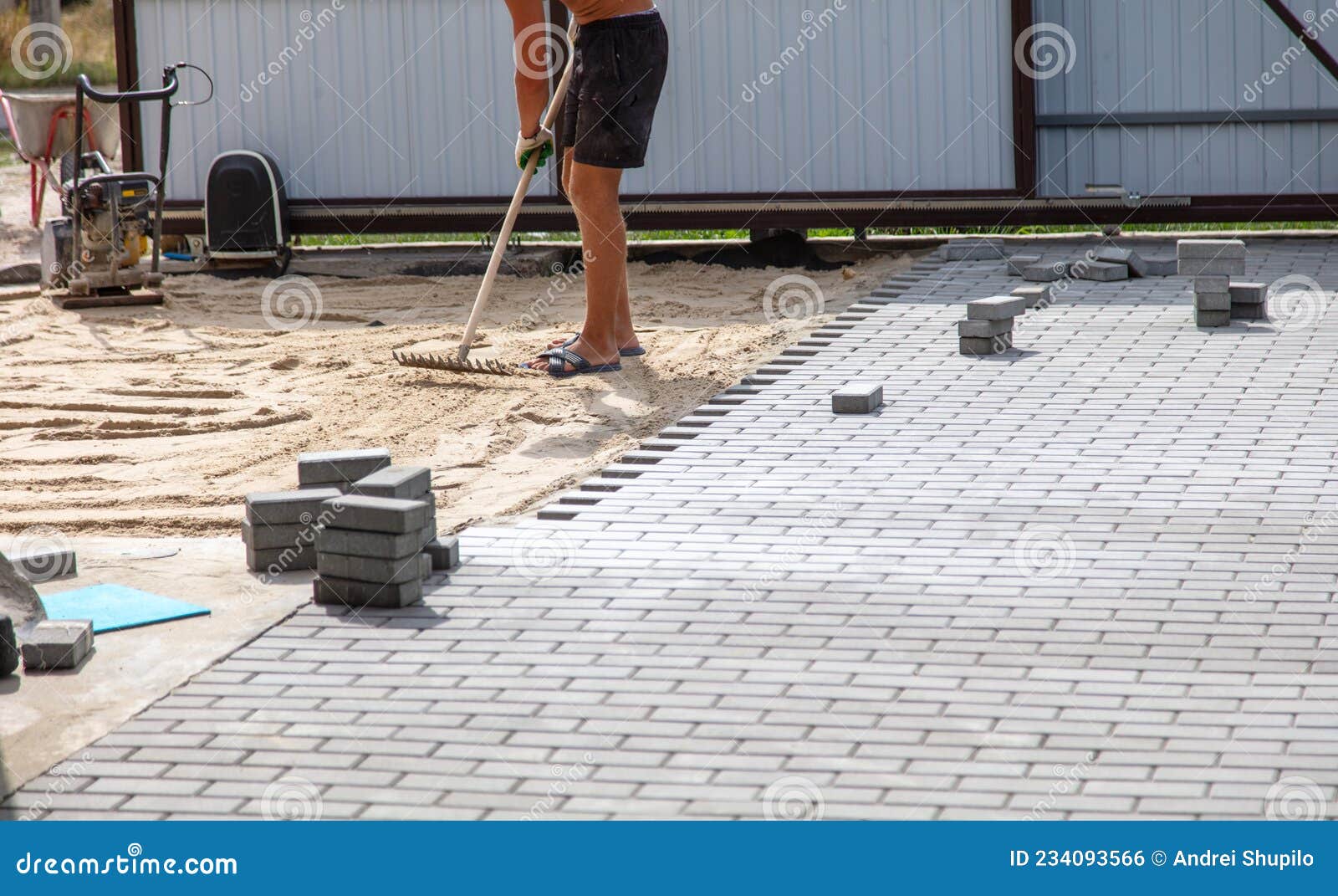 Laying Paving Slabs at a Construction Site. Stock Photo - Image of site ...